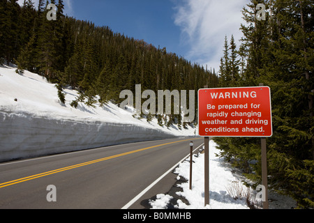 A sign warning of danger that reads, "Trees and Branches May Fall ...