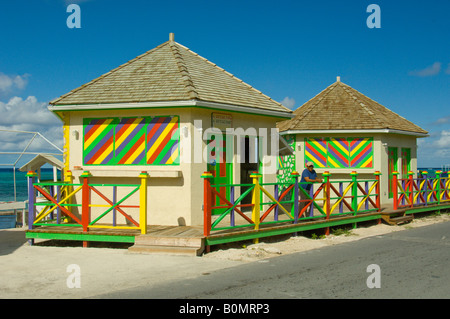 Colorful kiosks for selling souvenirs to tourists in Cockburn Town ...