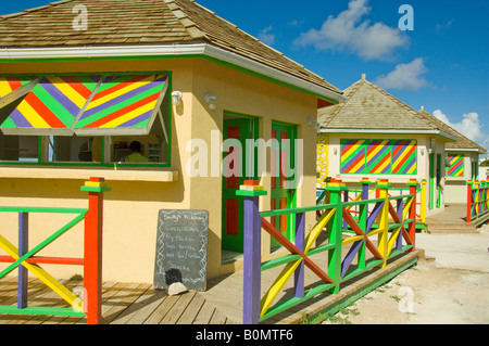 Colorful kiosks for selling souvenirs to tourists in Cockburn Town ...