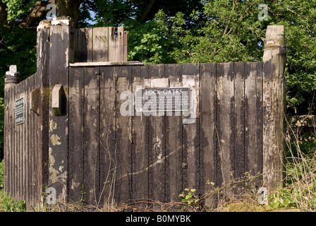 Old lock gates on disused and derelict section of the Neath Canal at ...