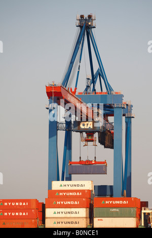 Warehouse, crane and shipping containers at quayside of North Sea Canal ...