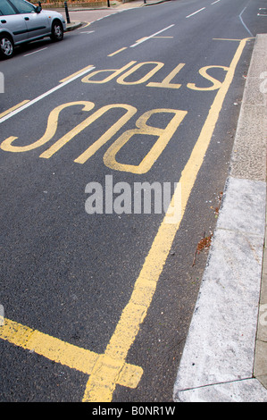 Yellow bus stop road marking symbolizing transport, mobility, travel ...