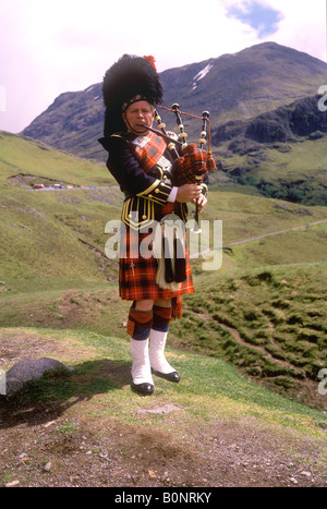Scottish piper Alexander McPhee playing in the picturesque setting of ...