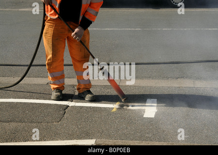 Thermal lance, burning off, road markings UK, thermoplastic material ...