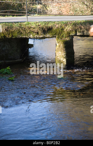 Granite bridge over stream at Widecombe Dartmoor Stock Photo - Alamy