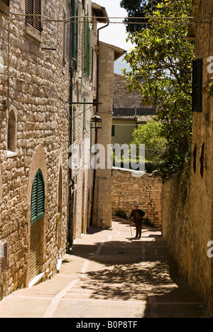 A typical small, quiet side street, lined with old red brick buildings ...