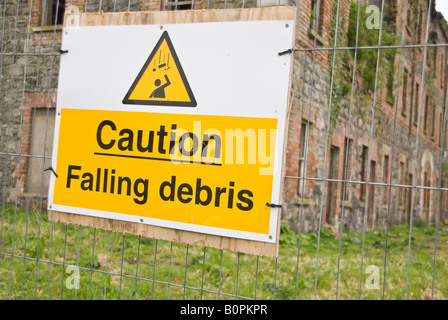 Danger Falling Masonry sign on a old red brick building Stock Photo - Alamy