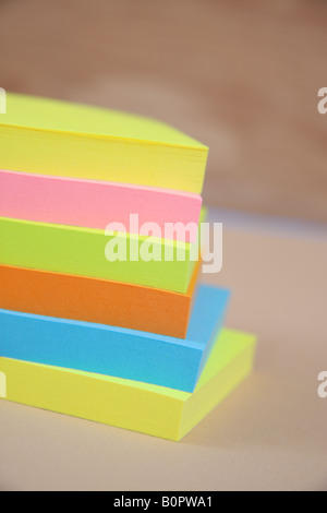 A stack of multi-coloured adhesive notepads Stock Photo - Alamy