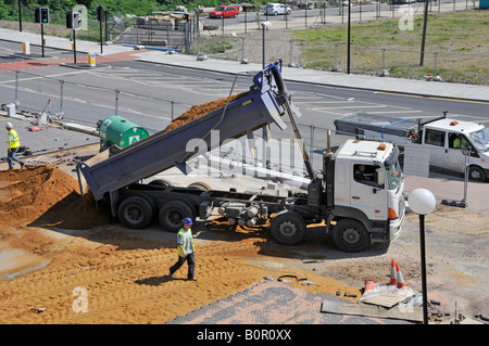 A banksman on a British construction site wearing personal protection ...