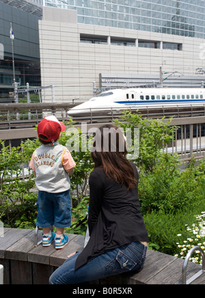 Shinkansen express train travels through the night, Shizuoka, Japan ...