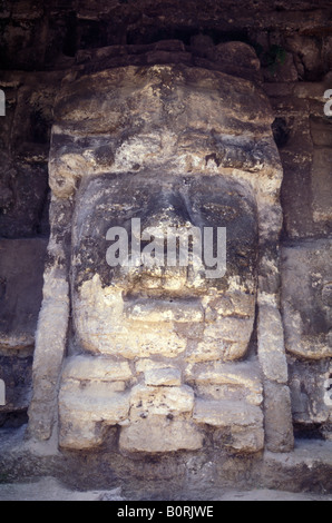 Huge limestone mask at the Mask Temple, Mayan ruins of Lamanai, Belize ...