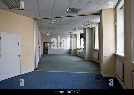 Empty, abandoned office with ceiling tiles and a grey carpet Stock ...