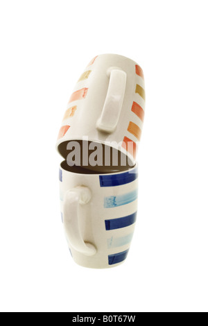 White ceramic mugs with Tea or coffee in it on a wooden table with copy ...