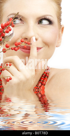 lovely blonde with red ashberry and cotton in water Stock Photo - Alamy