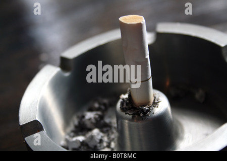 Ashing a cigarette close-up Stock Photo - Alamy
