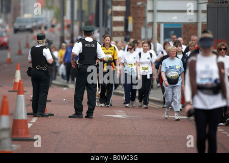Armed female PSNI officer directing traffic in Londonderry, Northern ...