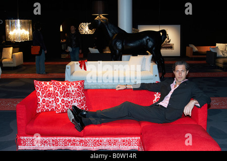designer Marcel Wanders on a sofa at Moooi brand booth during Salone ...
