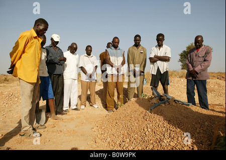 Funeral of a woman who died of HIV/AIDS, body wrapped in sheets, Garoua ...