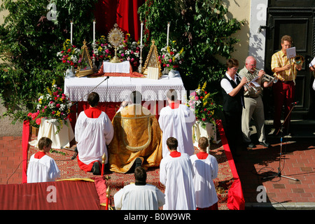 A man plays the trumpet next to photos of Fidel Castro at a school in ...