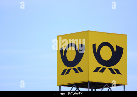 Yellow and black post horn emblem of Deutsche Post, German post office ...
