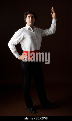 Stereotypical Spanish man in traditional clothing holding an acoustic ...