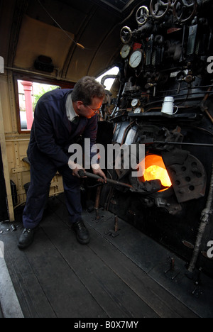 fireman shoveling coal on steam locomotive LMS BLACK 5 45231 great ...
