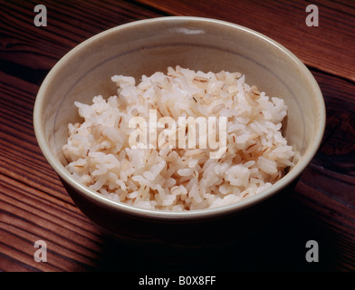 a bowl of japanese rice cooked with barley isolated on white background ...