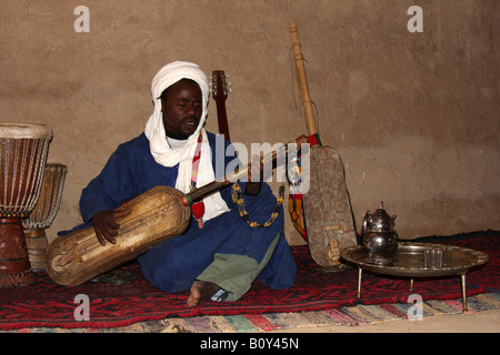 Hajhouj or guembri, Three stringed percussive lute, used in traditional ...