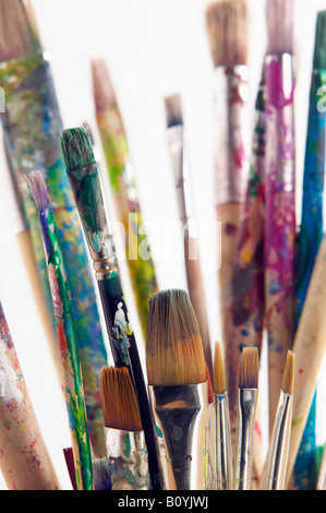 A used paint tin and paint brush Stock Photo - Alamy