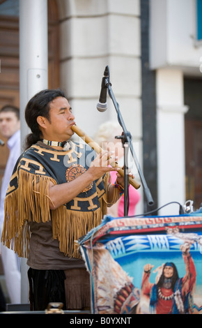 Native American red indian busker playing flute in Great Yarmouth ...
