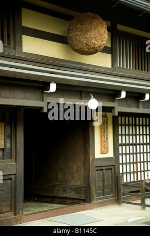 Traditional sake shop with cedar ball sign and shop entry curtain in ...
