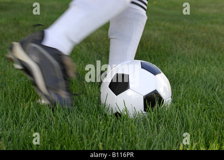 Soccer ball kicked into a goal Stock Photo - Alamy
