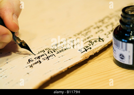 A man writes on birch bark using a fountain pen Stock Photo - Alamy