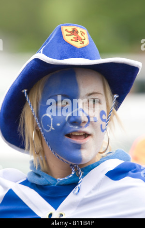 A Scotland fan in face paint looks on during the second half against ...