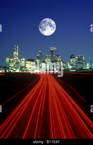 Houston downtown skyline at night with full moon as seen from Brazos ...