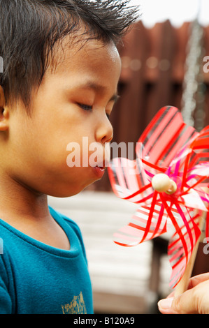 boy, pinwheel, blowing, boys, pinwheels Stock Photo - Alamy