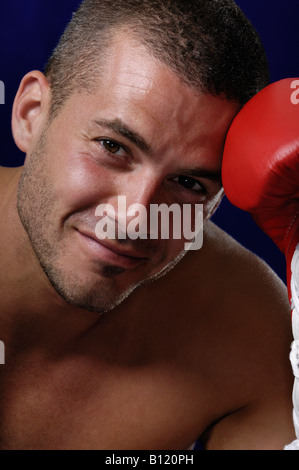 Man boxer training hard - Young black guy boxing in sport gym center ...
