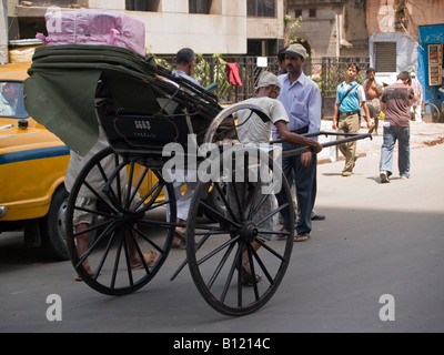 a human rickshaw driver in calcutta Stock Photo - Alamy