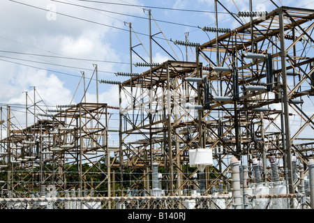 Transformers behind wire fence Stock Photo - Alamy