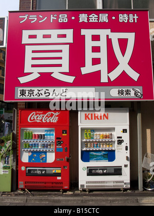 Two Japanese drink vending machines side by side. A Kirin drink company ...