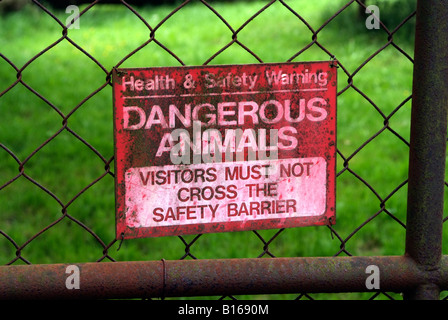 A sign at a zoo warning of dangerous animals Stock Photo - Alamy