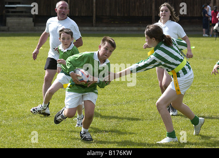 Teams of children playing tag rugby Stock Photo - Alamy