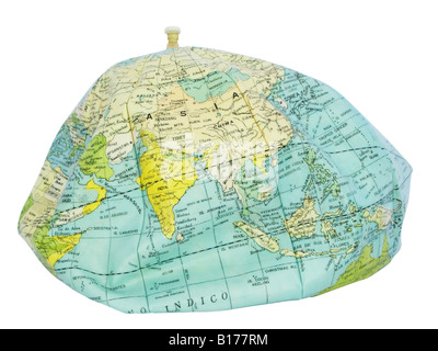 Deflated Earth Globe cut out on white background Stock Photo - Alamy