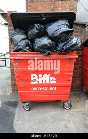 Overflowing red Biffa waste bin on street Ludlow Shropshire UK Stock ...