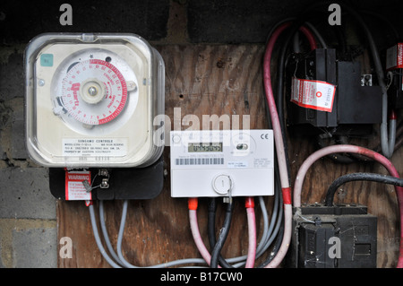 Domestic electricity meter with time clock that switches night time ...