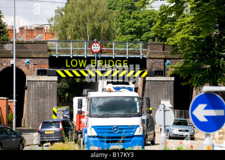 HGV lorries negotiate low railway bridge that is regularly hit causing ...