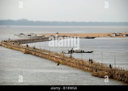 Cambodia, Kampong (Kompong) Cham, Koh Paen; hand built bamboo bridge ...