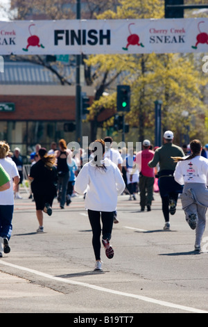 Runners sprint to the finish line in a heat of the men's 1,500-meters ...