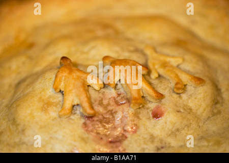 Pastry stick men figures on top of an apple pie Stock Photo - Alamy