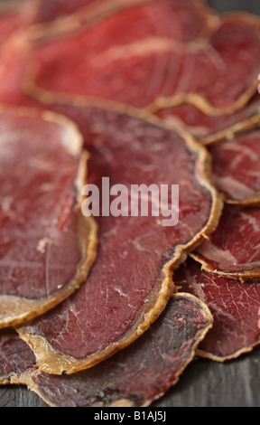 Slices of Cecina from Leon (air dried and smoked cured beef made from ...